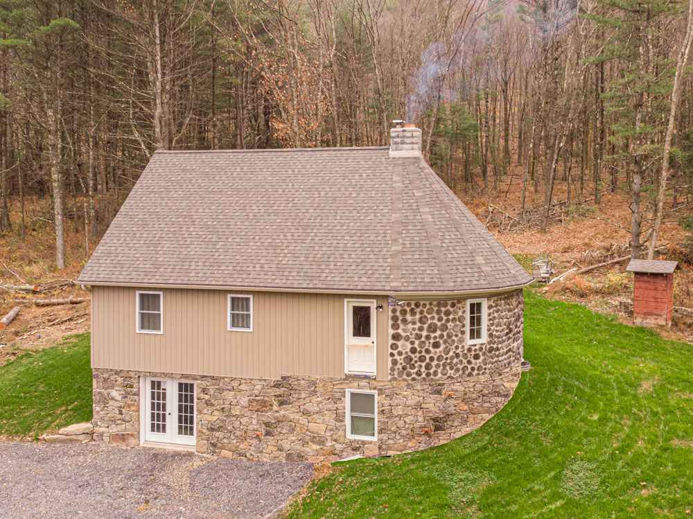 Historic Round Cabin Renovation - by Maple Grove Builders